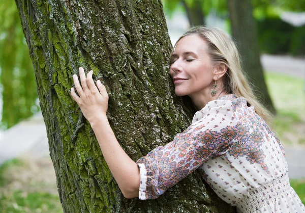 Woman hugging a tree - Stock Image - Everypixel