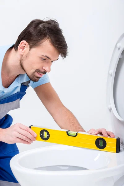 Plumber fixing toilet Stock Photos, Royalty Free Plumber fixing toilet ...