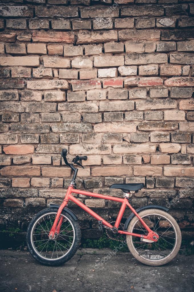 Vintage bicycle on brick wall background Stock Photo by ©markop 54138699