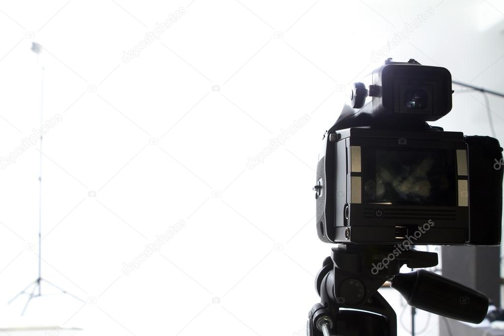 Professional camera in studio Stock Photo by ©markop 63641773