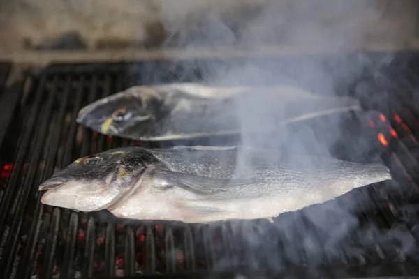 Sea bream fish on the grill. Grilled fish dish sea bream restaurant ...
