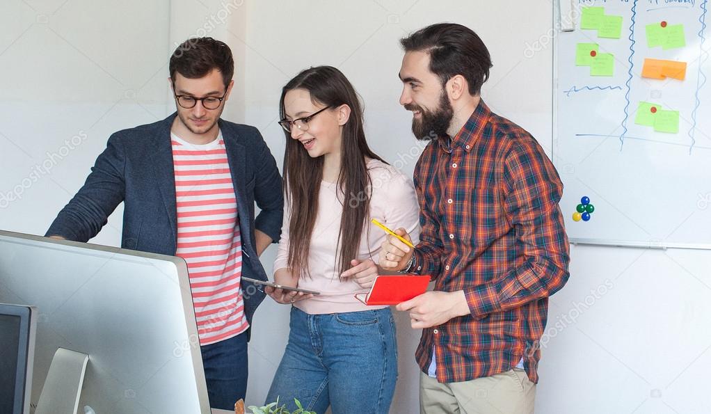 Team of three colleagues working in modern office — Stock Photo ...
