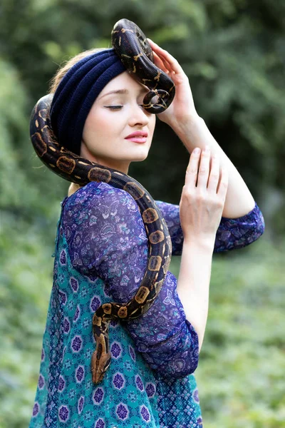 Woman holding snake Stock Photos, Royalty Free Woman holding snake ...