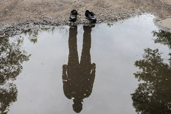 Human Reflection In Water