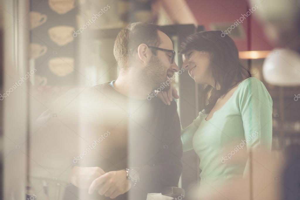 Romantic couple shot through window Stock Photo by ©chika_milan 53452487