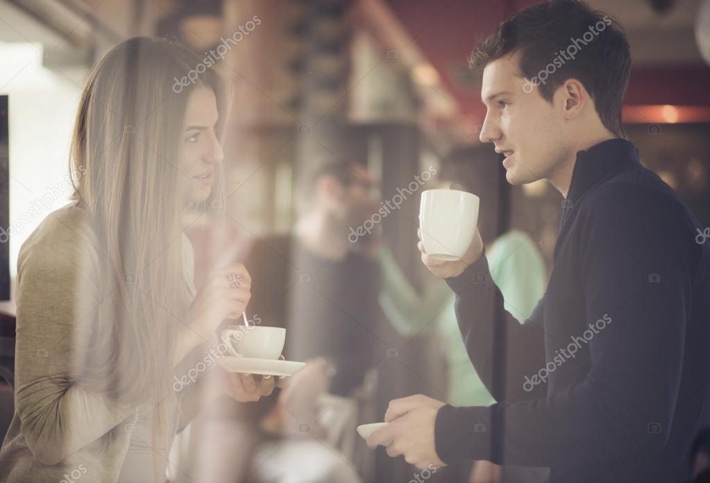 Two couples shot through window enjoying coffee Stock Photo by ©chika ...