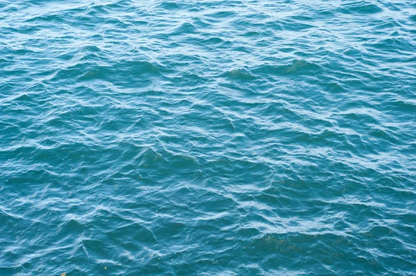 Blue sea water background — Stock Photo © Ale-ks #332343124