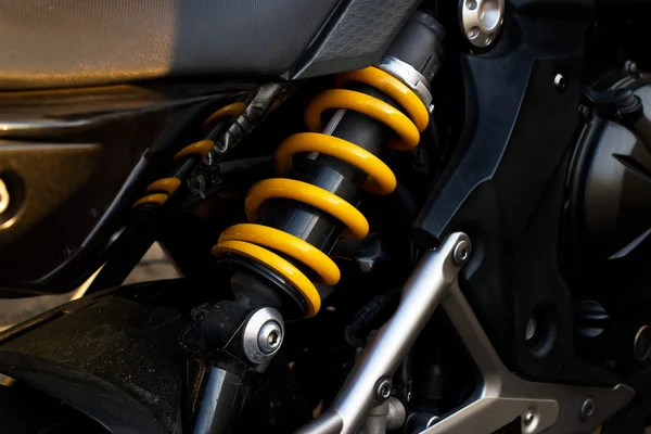 yellow shock Absorber's motorcycle - Stock Image - Everypixel