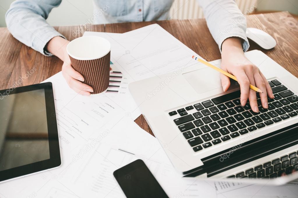 Manager working using laptop at the office on wooden table. Film Stock ...