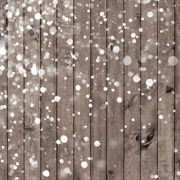 Christmas background with falling snow over wooden background Stock ...
