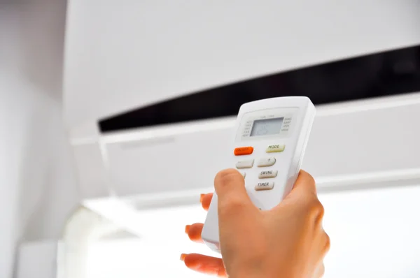 Turning on air conditioner Stock Photo by ©Ai825 56750961