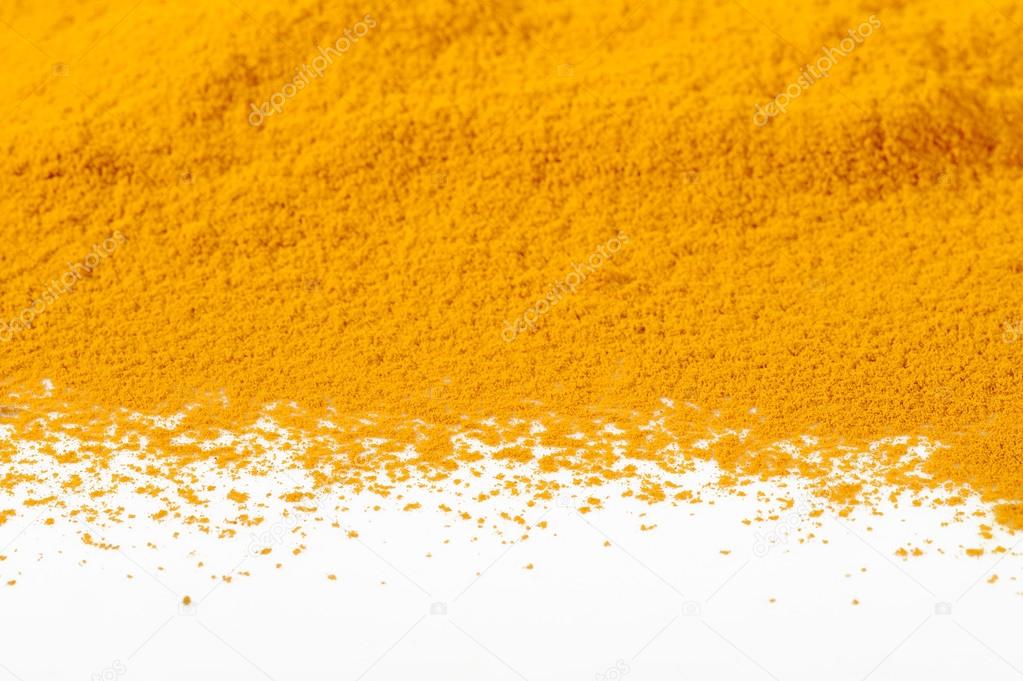 Turmeric powder on white background — Stock Photo © phloenphoto #55941601