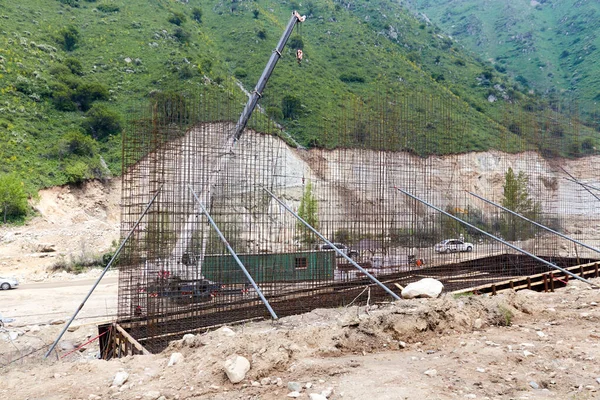 car crane and reinforcement frame installed on a construction site ...