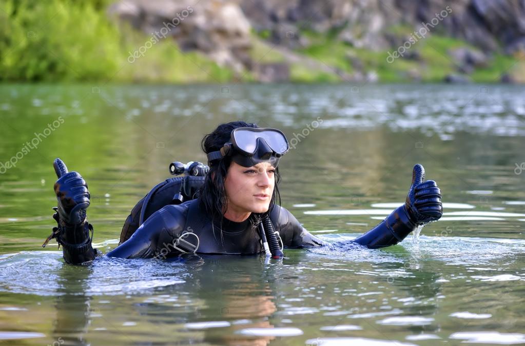 Beautiful woman diver making ok sign — Stock Photo © tutye #78652848