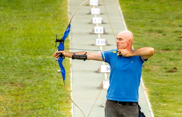 Man archer with a bow. - Stock Image - Everypixel