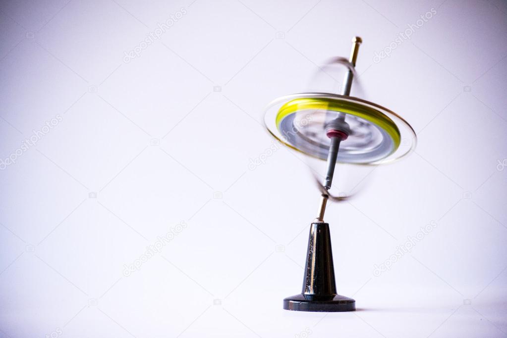 Gyroscope spining with yellow ring — Stock Photo © rmbarricarte #90765878