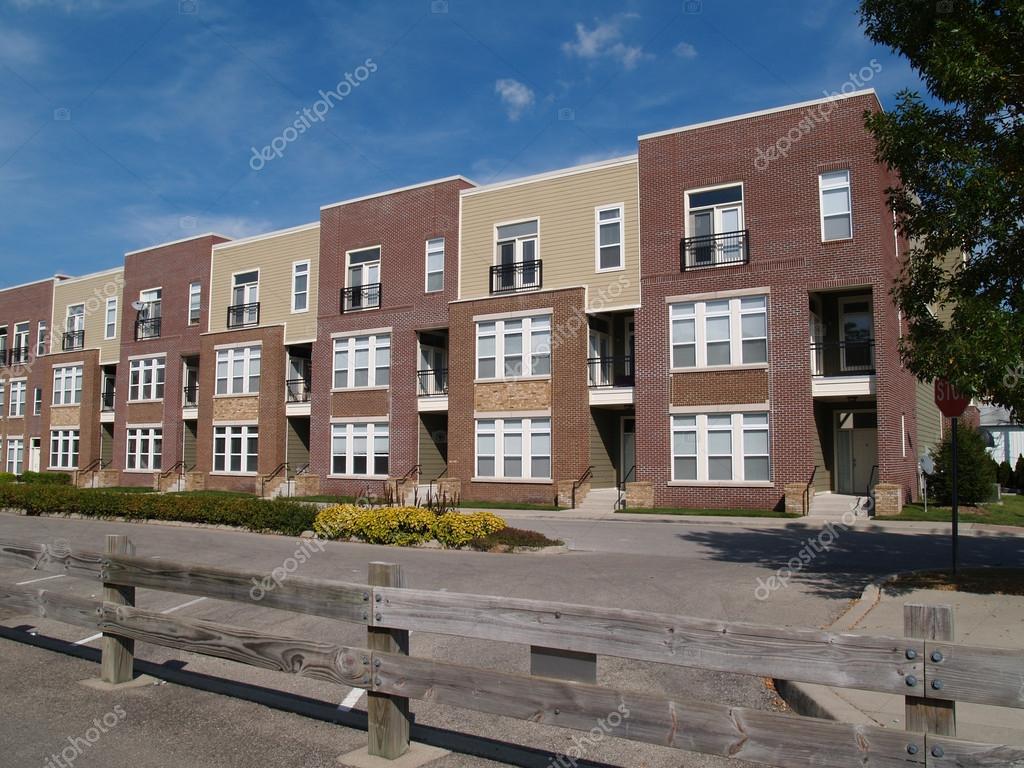 New townhouse or condo type homes made of different shades of brick and ...