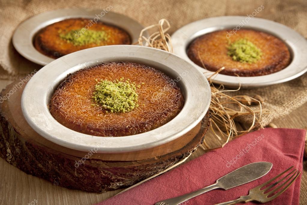 Delicious traditional Turkish kunefe with pistachio on it. Served hot ...