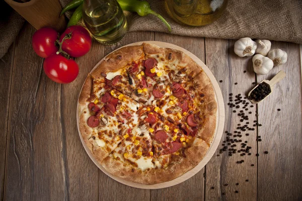 Delicious Italian supreme Pizza — Stock Photo © gorkemdemir #55571717