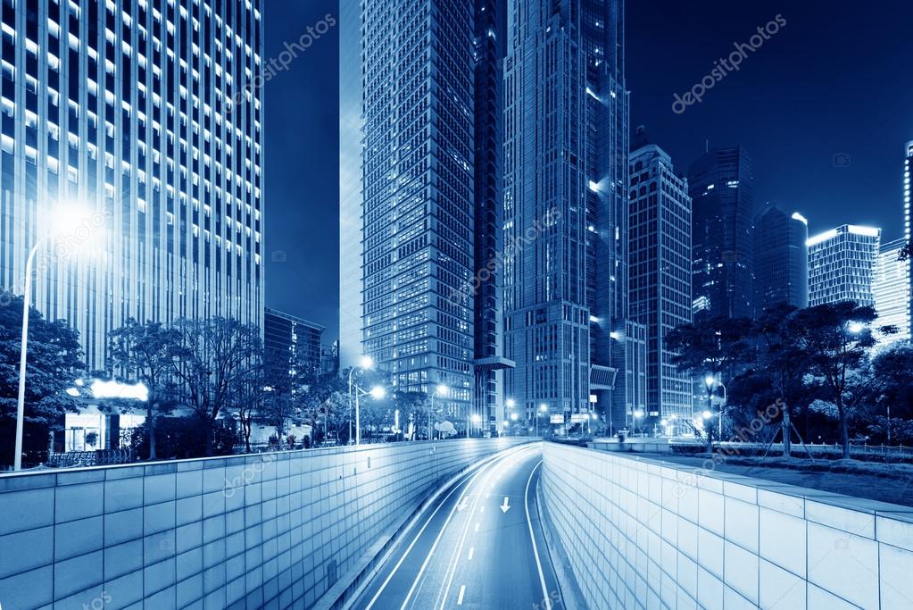 Light trails on buildings background Stock Photo by ©zorabc 66366173