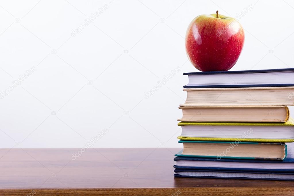 A stack of colorful books and open book. Ideas for business and self ...