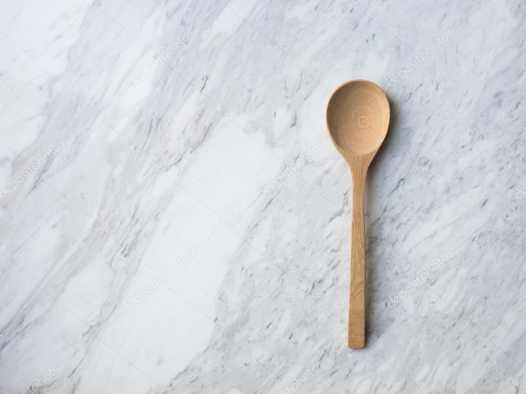 Wooden Spoon on white marble. Stock Photo by ©eggeeggjiew 106058868