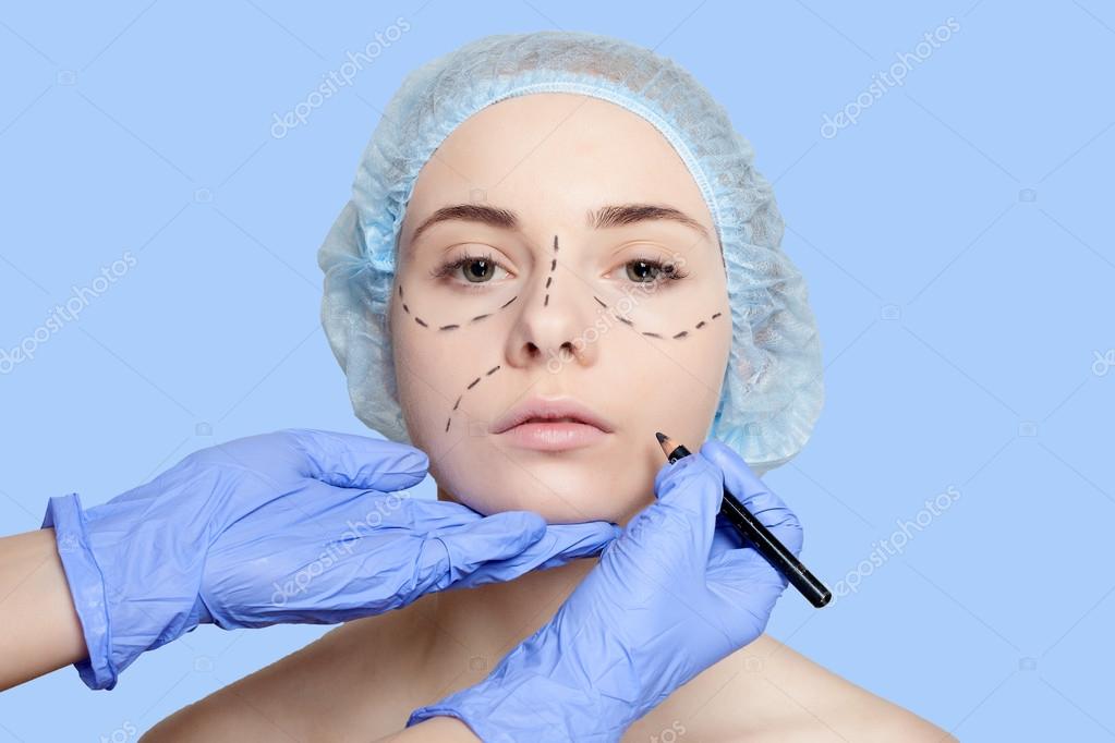 Beautiful young woman perforation lines plastic surgery operation Stock ...