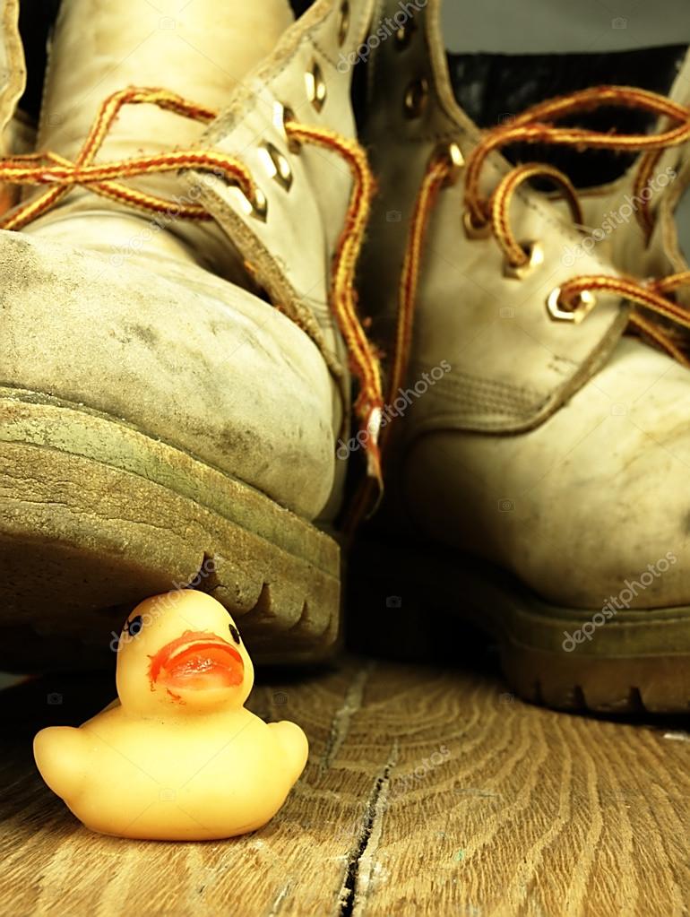 Rubber duck crushed by a heavy, old military boot. — Stock Photo ...
