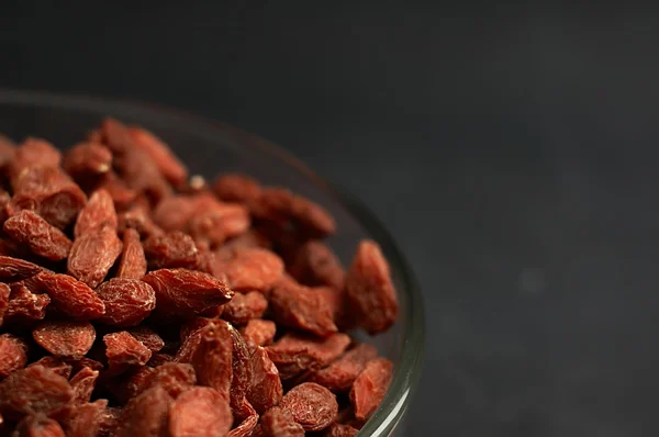 Dried goji berries on the table. - Stock Image - Everypixel