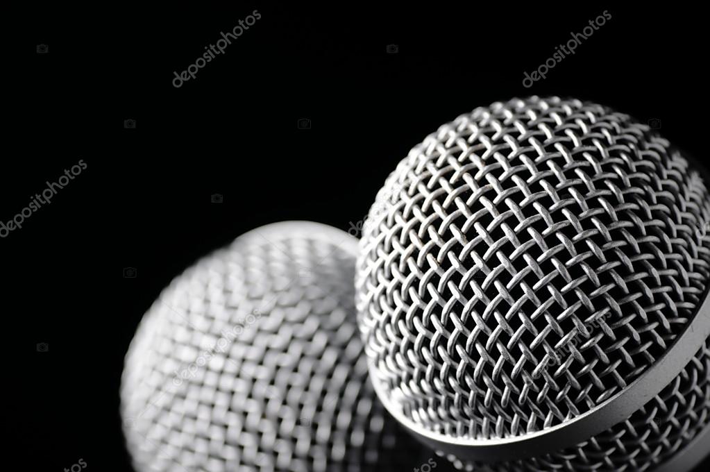 Two microphones on a black background. Stock Photo by ©Kamiwro1 91713500