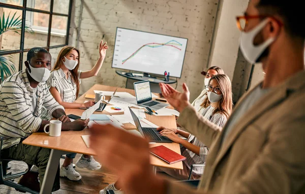 Diverse business worker discuss and meeting while Wearing Medical Mask ...