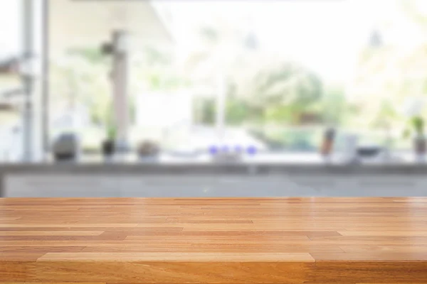 Empty wooden table and blurred kitchen background - Stock Image ...