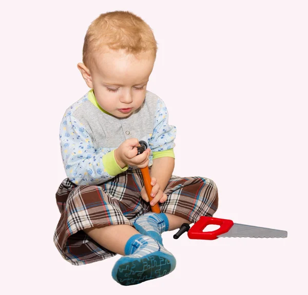 Little boy playing with tools Stock Photo by ©erierika 4189917