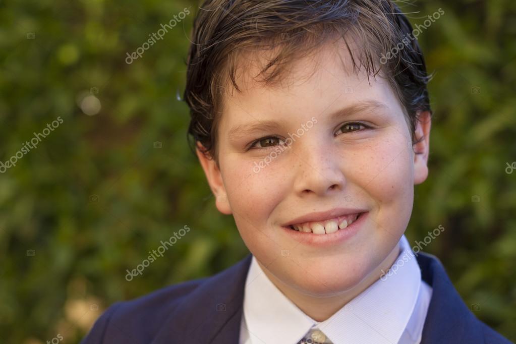 Boy first communion dress smiling to the camera — Stock Photo © paloma ...