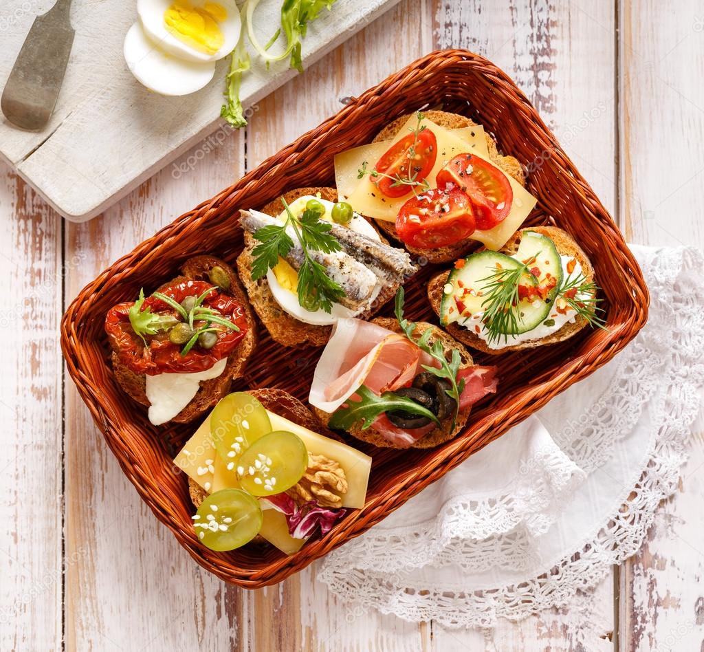 Canapes with various toppings, delicious breakfast or snack Stock Photo ...