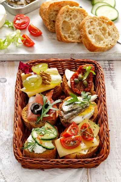 Canapes with various toppings, delicious breakfast or snack Stock Photo ...