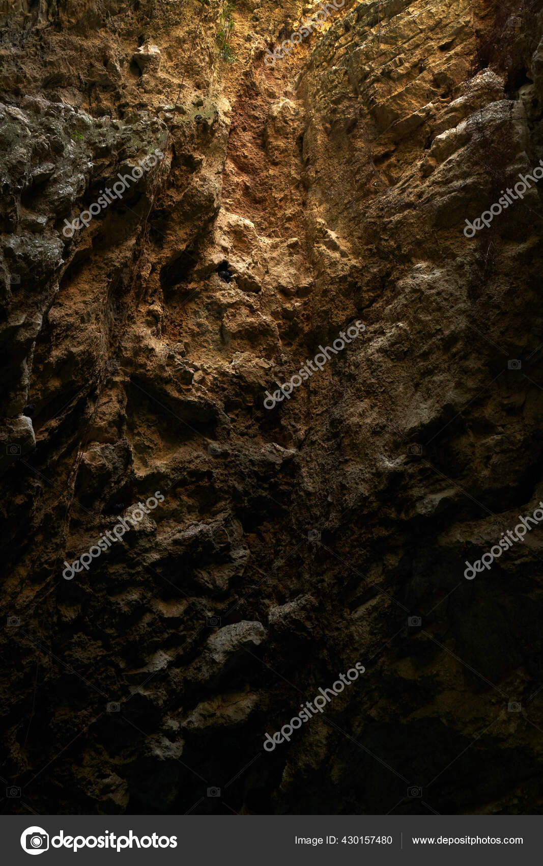 Inside a dark rock cave Stock Photo by ©Slavaleks 430157480