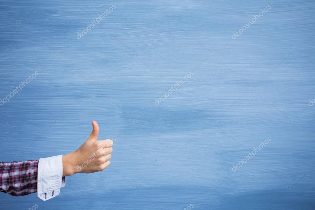 Hand showing thumbs up gesture Stock Photo by ©grinvalds 63361157