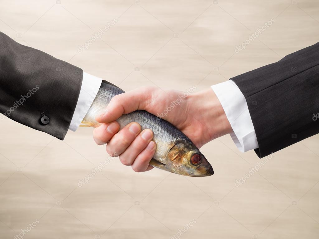 Dead Fish Handshake — Stock Photo © grinvalds #63737439