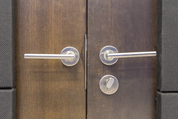 Door handles installed at the entrance to the studio. - Stock Image ...