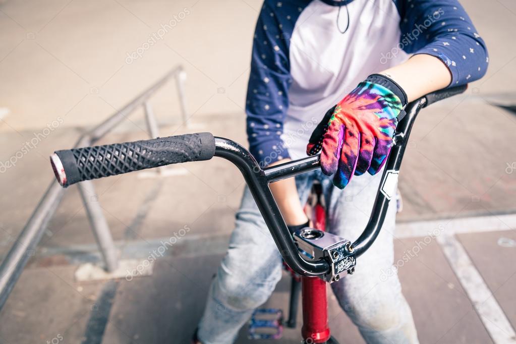 BMX rider on his bicycle in a helmet — Stock Photo © LazorPhotography ...