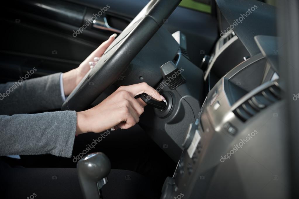 Woman starting car engine Stock Photo by ©stockasso 56268977