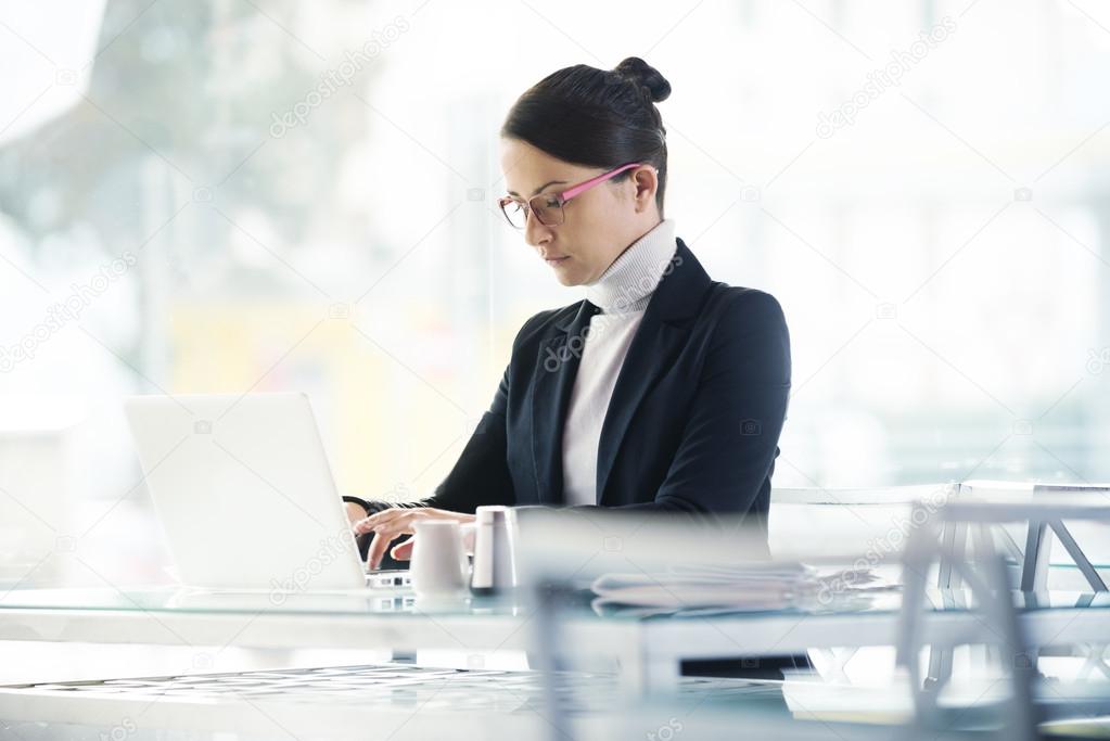 Busy woman working on her laptop — Stock Photo © stockasso #65520703