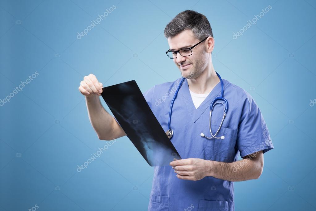 Radiologist checking an x-ray image Stock Photo by ©stockasso 65533959
