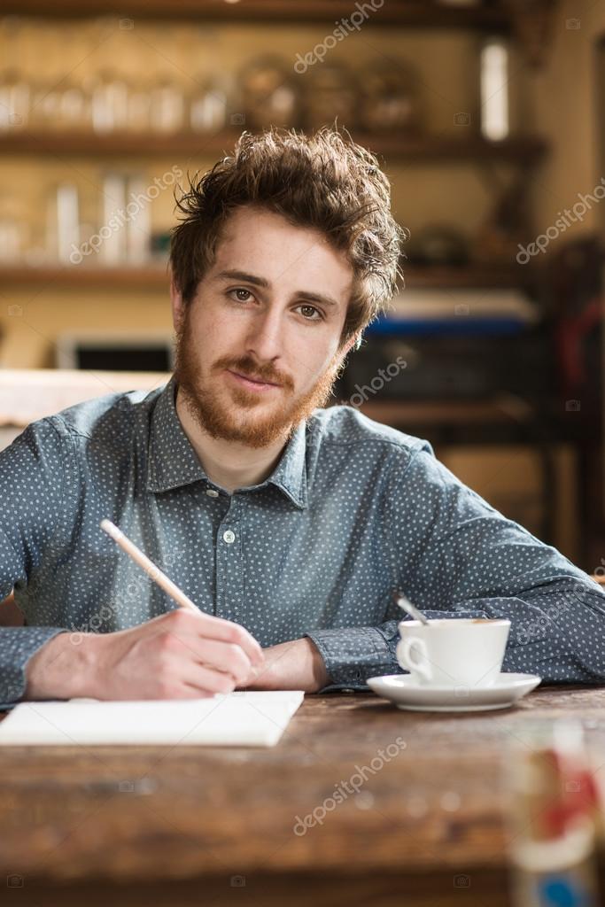 Man sketching on his notebook Stock Photo by ©stockasso 76329575