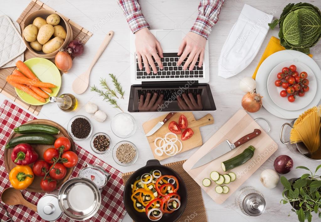 Cooking at home with online recipes — Stock Photo © stockasso #76397943