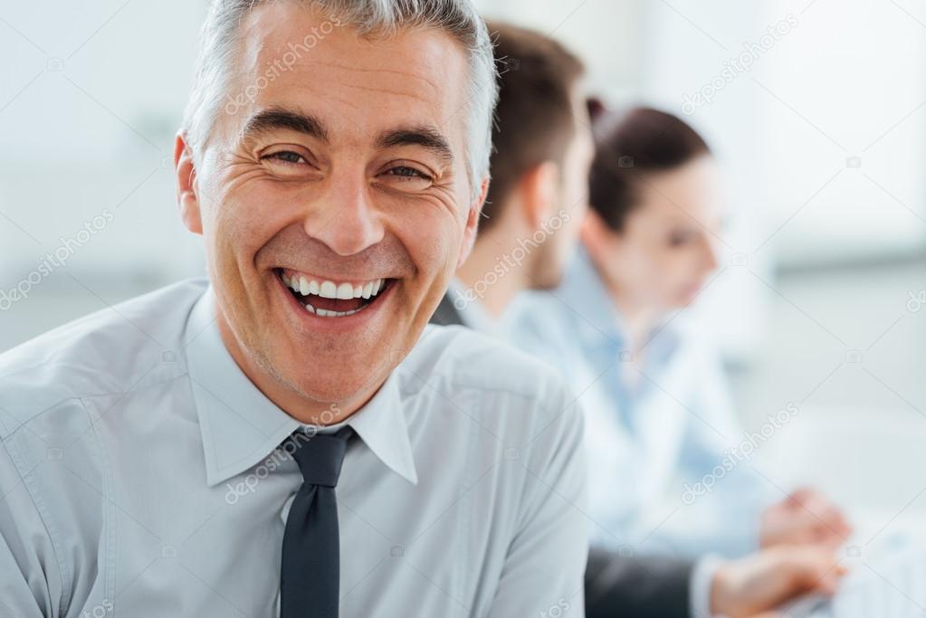 Confident smiling businessman posing Stock Photo by ©stockasso 76571141 Confident smiling businessman posing Stock Photo by ©stockasso 76571141