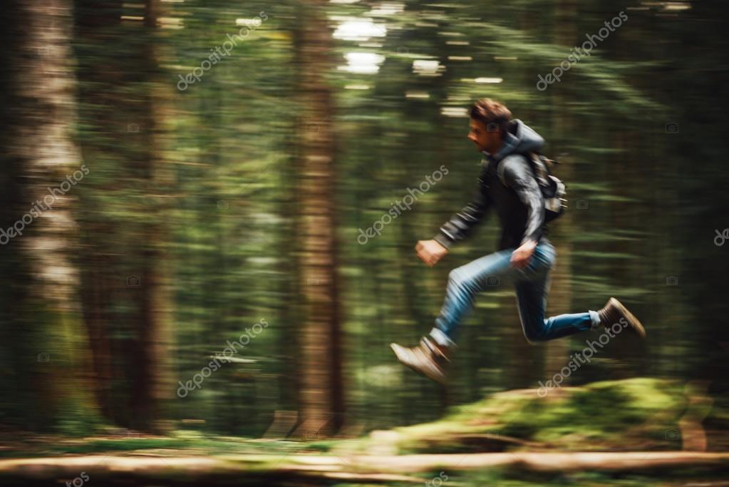 Man running in the forest — Stock Photo © stockasso #88021380