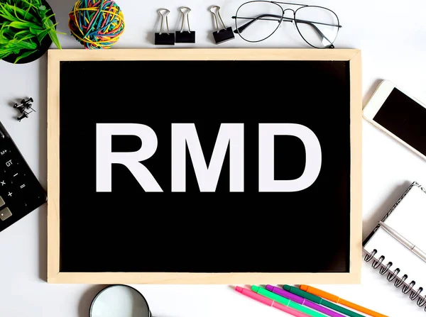RMD Concept on drawing board with office tools - Stock Image - Everypixel