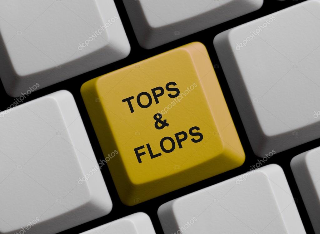 Yellow computer keyboard showing tops and flops in german language ...